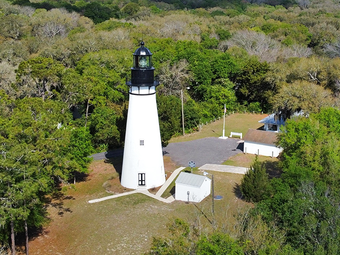 The historic Amelia Island Lighthouse stands tall since 1839, Florida's oldest beacon still guiding modern adventurers to this coastal paradise.