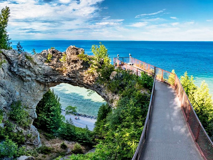Nature's perfect picture frame, Arch Rock soars 146 feet above Lake Huron, creating a limestone portal to breathtaking blue waters.