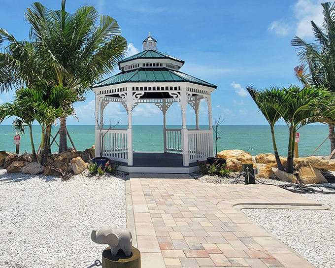 This charming beachfront gazebo offers front-row seats to Gulf sunsets that transform the sky into a painter's palette of impossible colors.