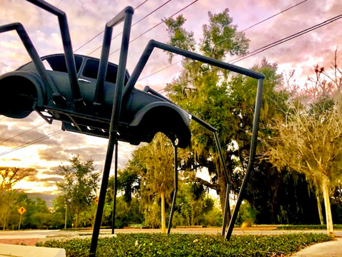 Sunset casts dramatic shadows from this mechanical marvel, creating an even more surreal silhouette against Florida's evening sky.