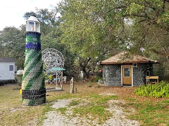 Morning light plays across the bottle tower and companion building, each glass vessel catching and scattering sunshine in mesmerizing patterns.