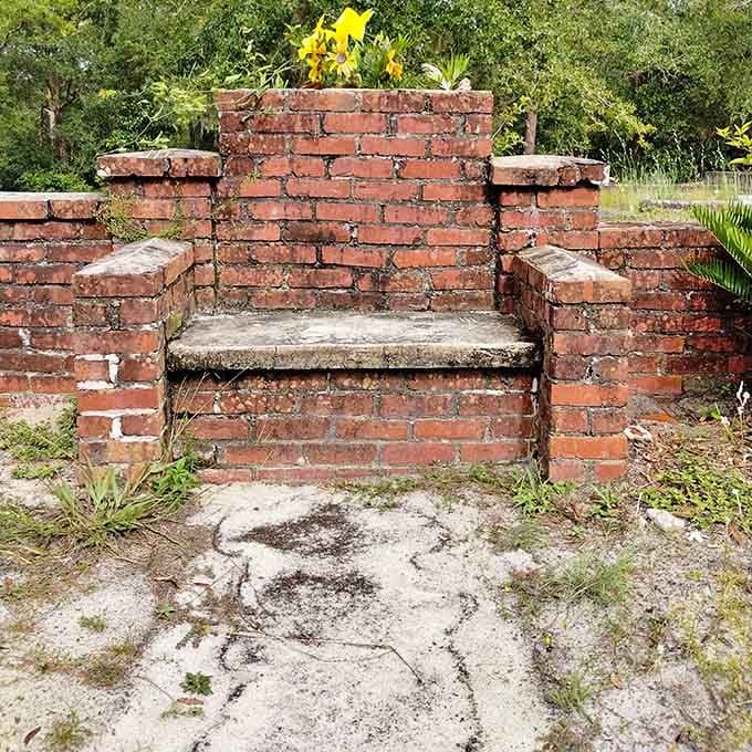 Time and weather have given this brick bench the kind of authentic patina that set designers spend fortunes trying to replicate, proving that genuine creepiness can't be rushed.