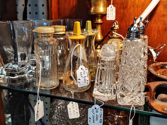 Crystal decanters and delicate glass shakers stand like transparent sentinels of bygone dinner parties, catching light and memories in equal measure.