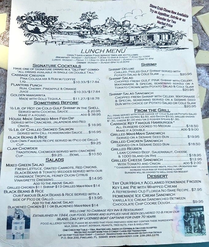 The menu reads like a love letter to Florida seafood, featuring everything from stone crab claws to the legendary cheeseburger in paradise.