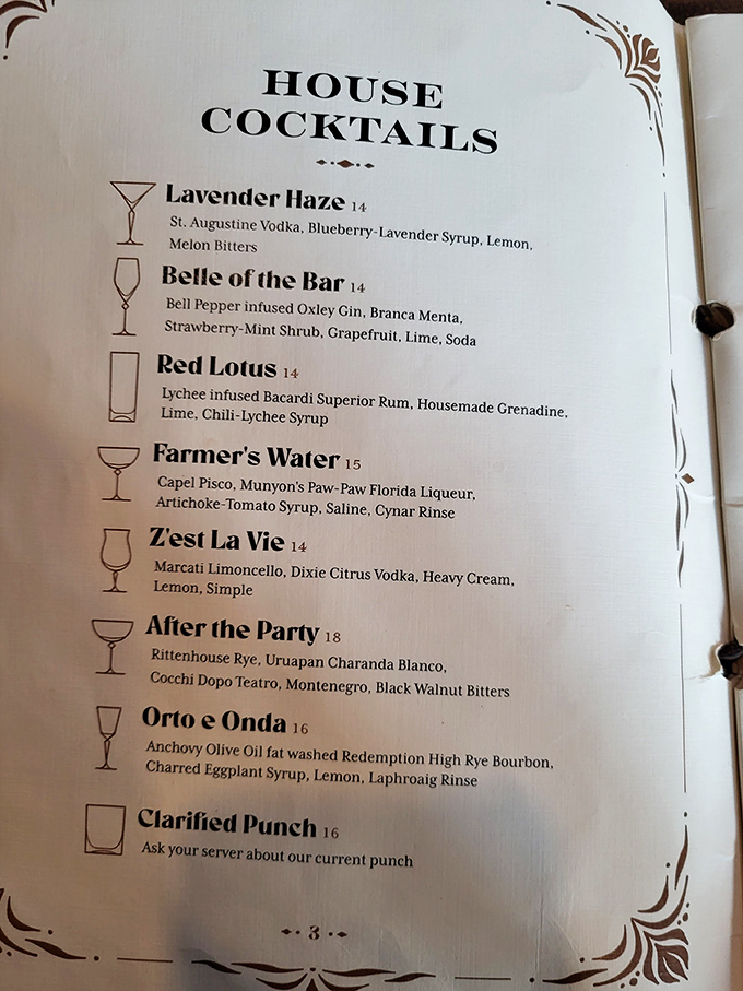 Liquid poetry: Bar 1903's cocktail menu reads like literature, each description promising flavor adventures rather than mere ingredients.