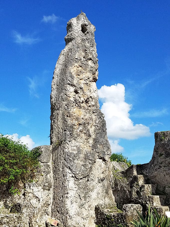 This towering obelisk reaches skyward like a stone finger pointing accusingly at conventional wisdom. How did one man raise this alone?