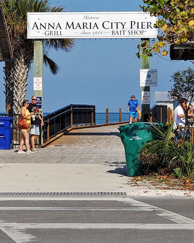 The Historic Anna Maria City Pier welcomes visitors with its weathered sign – a gateway to both fishing adventures and fresh seafood feasts.