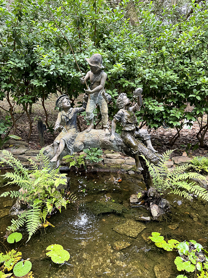 Children frolic eternally in bronze around this serene pond, their frozen play a timeless reminder of joy amid the garden's tranquility.