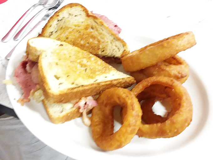 This isn't just lunch &ndash; it's a masterpiece of balance. Crispy, golden onion rings complement the hearty Reuben sandwich in perfect harmony.
