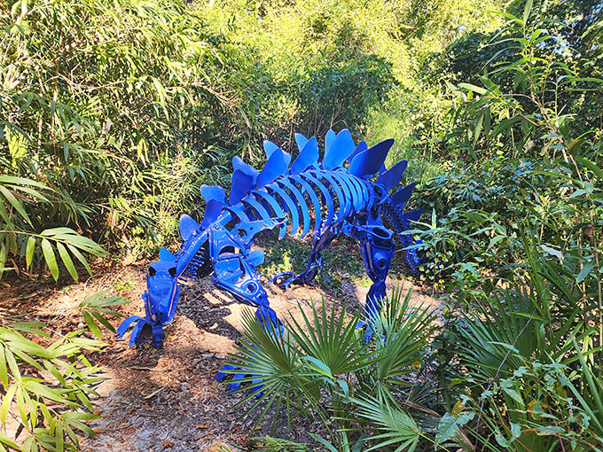 This brilliant blue stegosaurus lurks among the palmettos, looking like it wandered straight out of a child's crayon-enhanced dinosaur book.