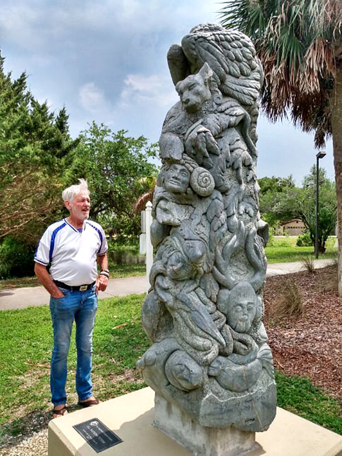 Stone faces tell silent stories &ndash; this totem-like sculpture creates a conversation between artist and observer against Florida's blue sky.