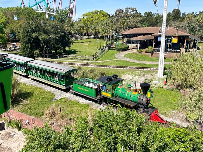 Train ride fun: The train winds through the park's landscape, offering glimpses of both thrilling rides and serene animal habitats in one panoramic journey.