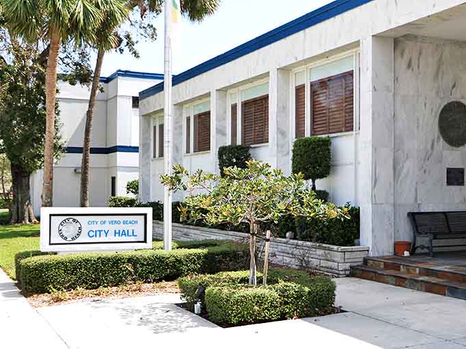 Vero Beach City Hall welcomes visitors with its distinctive blue trim and pristine white fa&ccedil;ade &ndash; civic pride wrapped in coastal elegance.