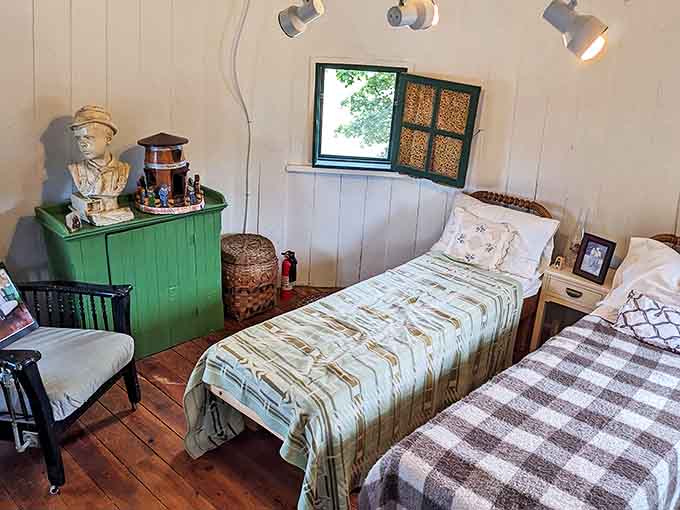 Twin beds tucked against rounded walls show how summer cottage life worked when your vacation home was literally shaped like a condiment container.
