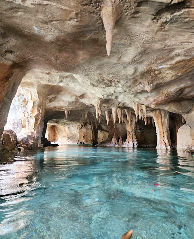 Nature's own cathedral &ndash; stalactites hang from the ceiling of this mystical underwater cave, illuminated by ethereal blue waters.