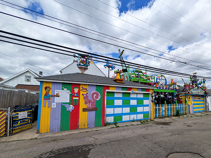 A patchwork of primary colors transforms humble garages into a canvas of joy, proving beauty can bloom in the most unexpected places.