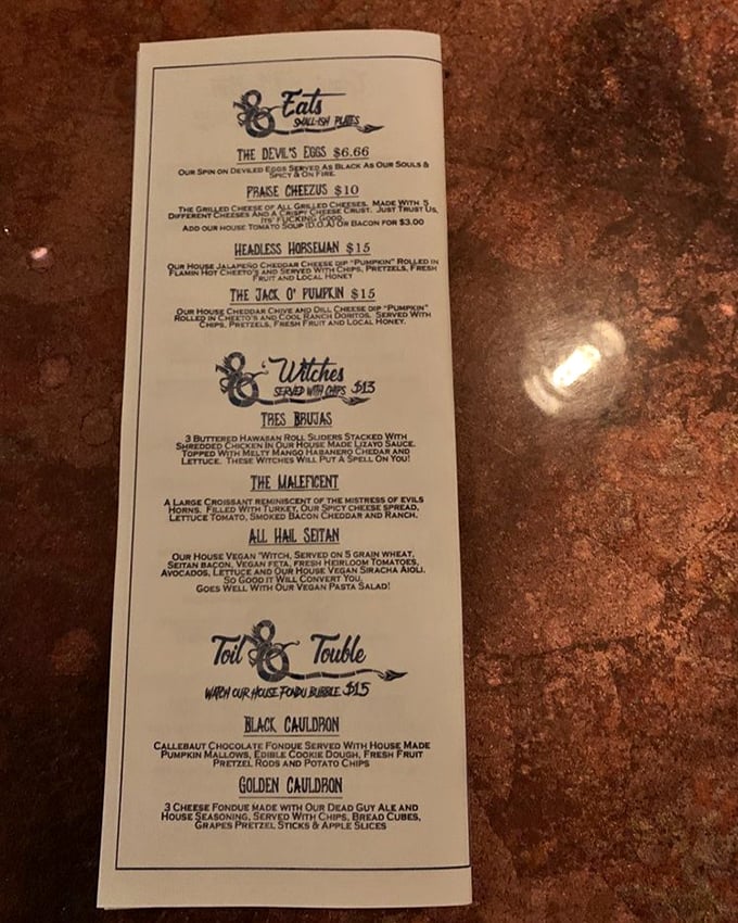 The menu offers wickedly named treats like "The Devil's Eggs" and "Headless Horseman" cheese dip that's both delicious and disturbing.