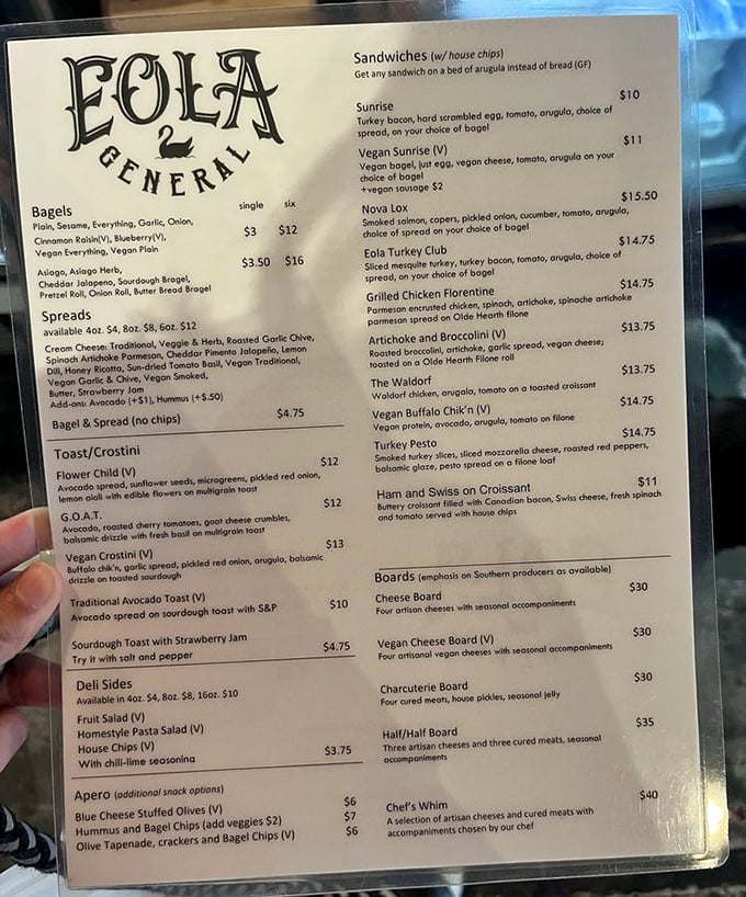 The menu board reveals a sandwich lover's dream – from bagels to boards, each option promises flavor combinations that'll make your taste buds dance.