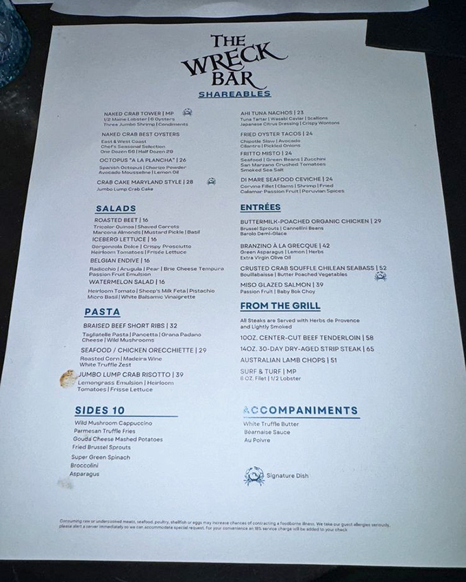 A menu that reads like a treasure map for seafood lovers. The Naked Crab Tower isn't what it sounds like, but it's exactly what you want.