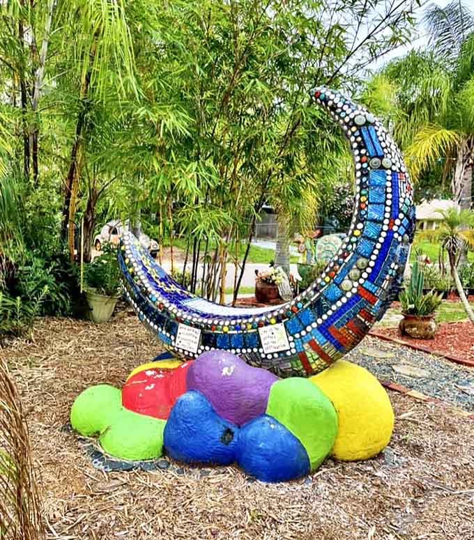 The cosmic crescent moon installation seems to wink at visitors, resting atop rainbow spheres like a celestial playground.