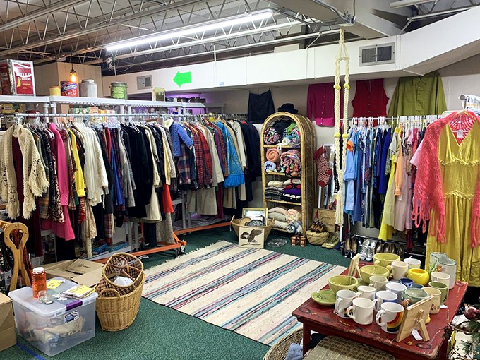 Vintage clothing racks burst with fashion history &ndash; each garment whispering tales of sock hops, disco nights, and summer romances.