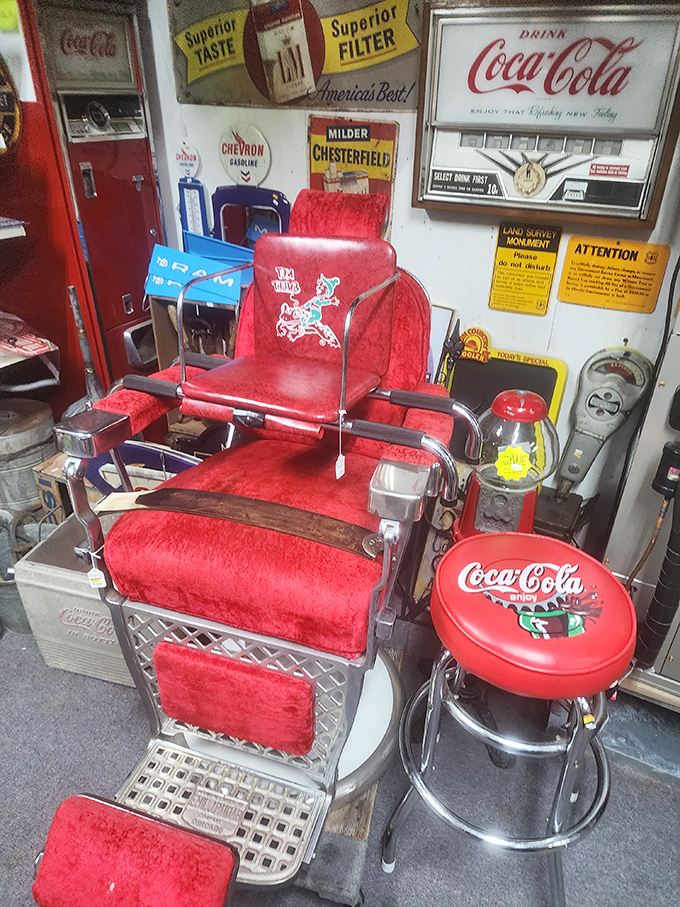 This crimson throne isn't just a barber chair, it's a time machine to when haircuts came with neighborhood gossip and an ice-cold Coke.