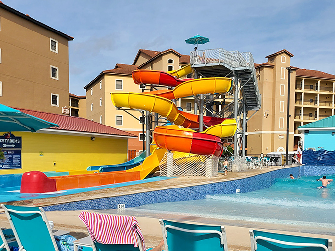 Colorful waterslides twist against the blue Orlando sky, promising thrills that make your stomach drop faster than your inhibitions.