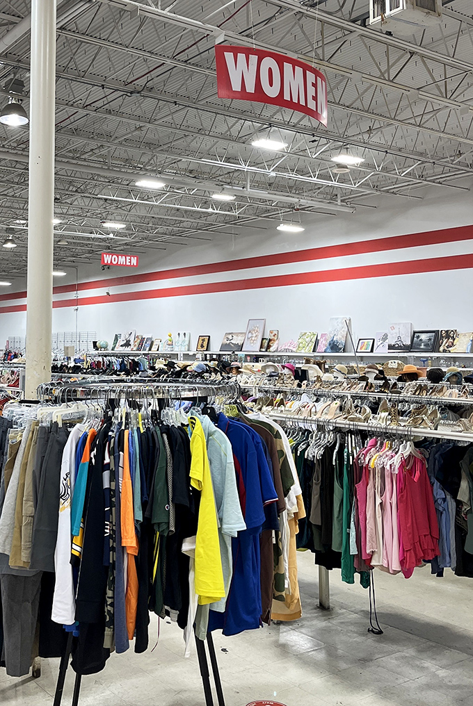 The women's section stretches toward the horizon, a textile rainbow where designer labels mingle democratically with everyday brands.