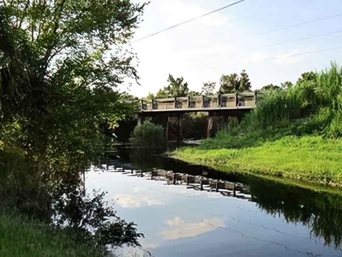 This peaceful bridge over dark water looks innocent enough, until you remember you're on a road with "Bloody" in its name.