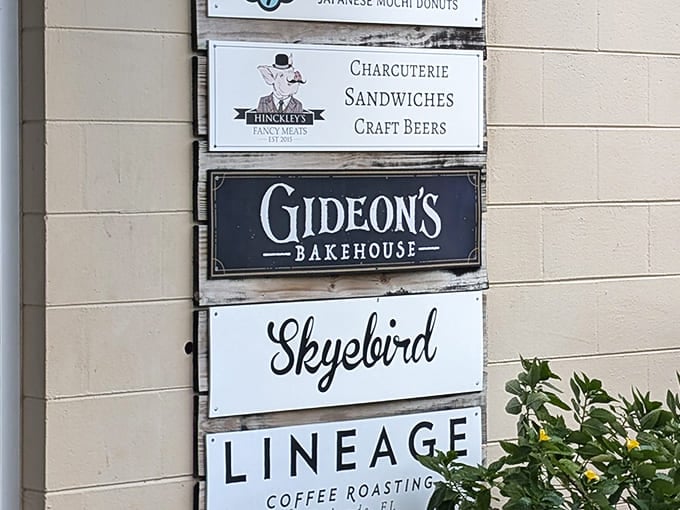 Multiple bakery signs stack up outside this Orlando location, with Gideon's Bakehouse promising legendary cookies.