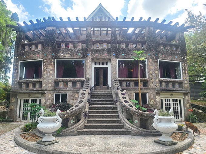 Wonder House rises like a stone castle from suburban Bartow, its grand staircase and intricate stonework defying ordinary architecture.