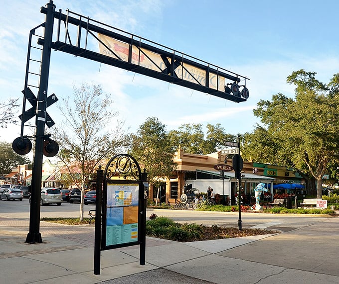Shop signs point visitors to Dunedin's many attractions, from waterfront parks to local breweries, all within this pedestrian-friendly coastal community.