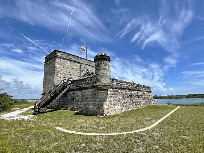 The historic stone fortress stands proudly against the Florida sky, its weathered walls telling stories of colonial conflicts and coastal defense.