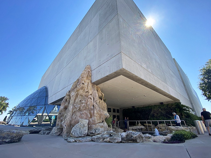 
Sunlight plays across the Dali Museum's distinctive glass bubble and modern concrete angles, while the entrance fountain adds a touch of natural serenity.