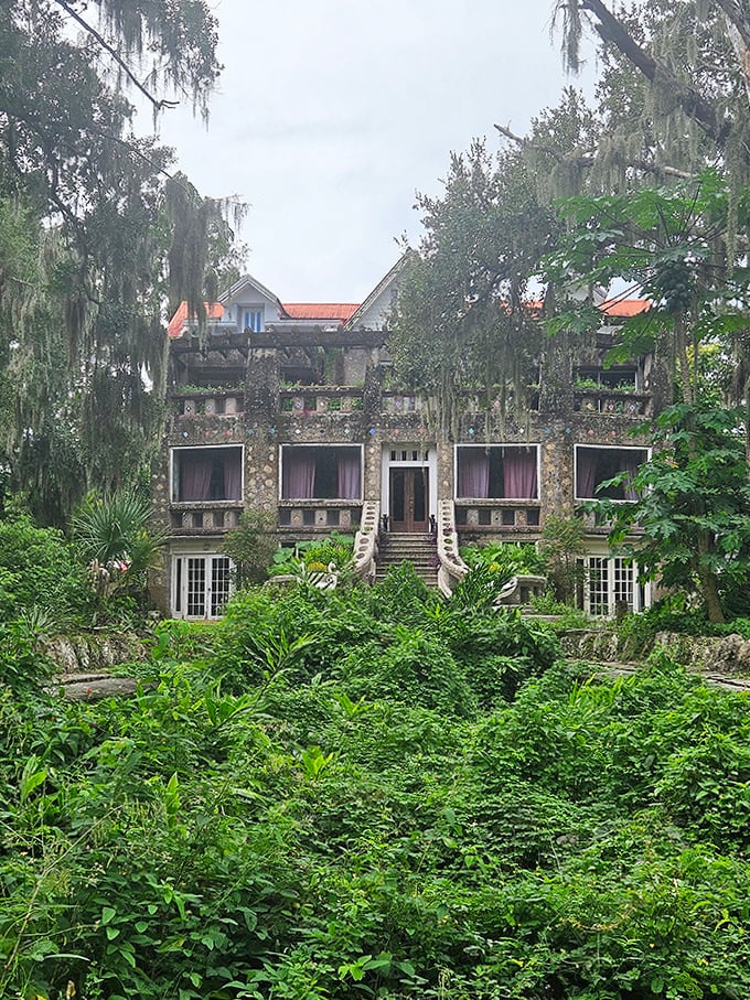 The Wonder House's weathered stone exterior tells stories of ingenious design, with multiple levels and balconies creating a fortress-like appearance.