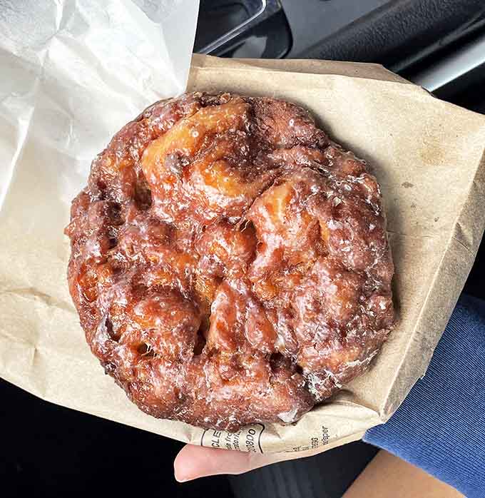 The legendary apple fritter – a craggy, glazed masterpiece that makes you question why you'd ever eat anything else.