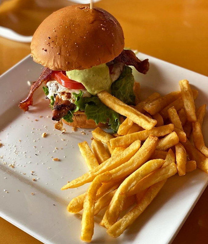 Not your average theme park sandwich &ndash; this beauty combines crispy bacon, fresh greens, and juicy chicken on a perfect bun.