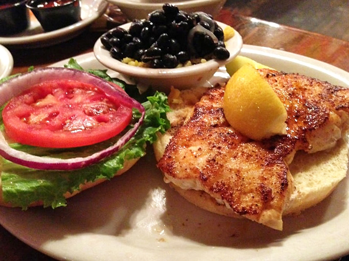 This isn't just lunch, it's a religious experience &ndash; perfectly blackened grouper with all the fixings and a side of black beans that'll make you question everything you thought you knew about sides.