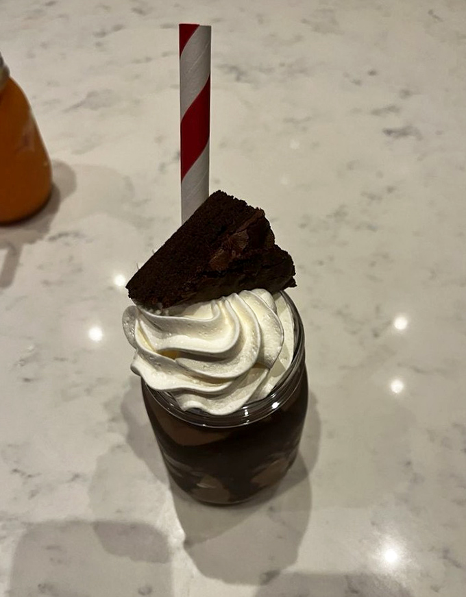 Chocolate perfection in a jar &ndash; this brownie-topped creation isn't just dessert, it's architecture with a sugar rush.