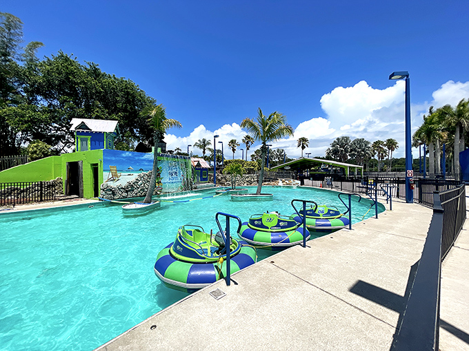 Colorful bumper boats await their pilots, complete with water cannons perfect for soaking unsuspecting friends on hot Florida days.