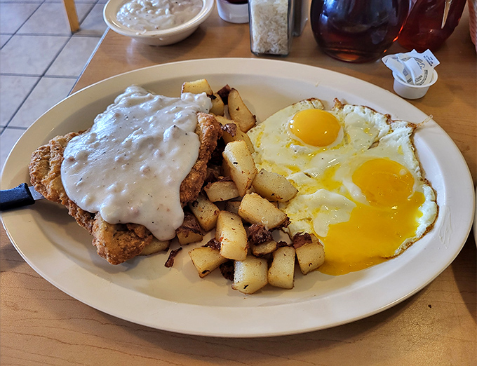 Country fried steak shines with crispy edges, rich gravy, and hearty sides that define true diner comfort.