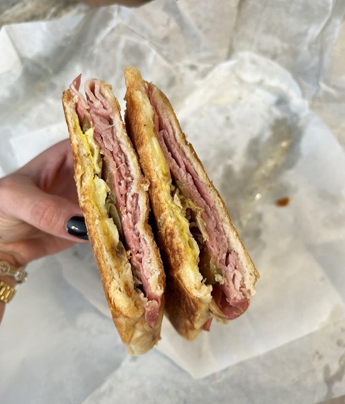 This Cuban sandwich isn't just lunch &ndash; it's an edible history lesson with layers of ham, roasted pork, and Swiss cheese pressed to crispy perfection.