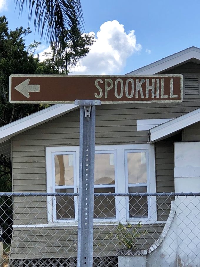 Brown directional signs point the way to Spook Hill &ndash; Florida's humble roadside attraction that continues to baffle and delight.