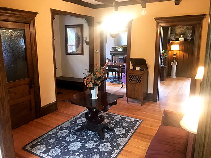 Welcome Home: Rich woodwork and period details greet visitors in the foyer, setting the tone for a stay steeped in historic charm.