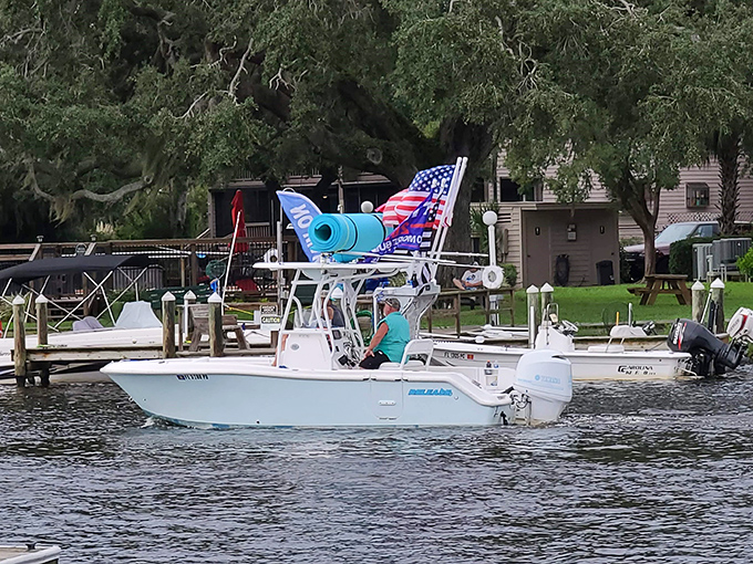 Boaters cruise past Monkey Island, probably wondering if their insurance covers "damage from airborne banana peels."
