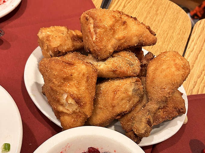 Golden, crispy, and piled high, this fried chicken has earned its legendary status one perfectly seasoned piece at a time.