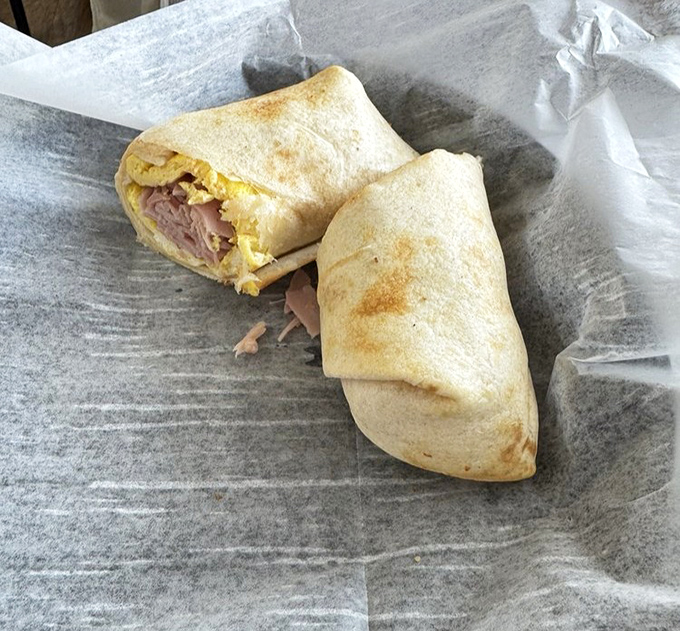This breakfast burrito doesn't need fancy packaging or a clever name &ndash; just eggs, ham, and cheese wrapped in morning happiness.