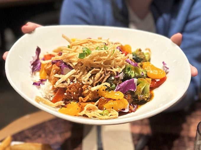 This vibrant stir-fry bowl bursts with color and texture &ndash; crispy vegetables, tender chicken, and a sauce that would make even the rainforest's exotic flora jealous.