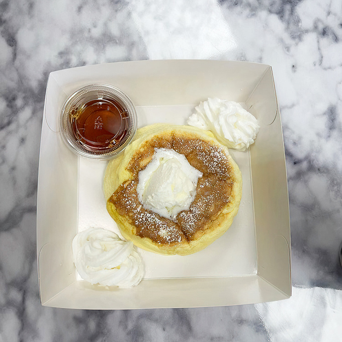 The Kumo Fluffcake arrives like a dessert celebrity &ndash; impossibly tall, dusted with powdered sugar, and ready for its close-up before the first delicious bite.