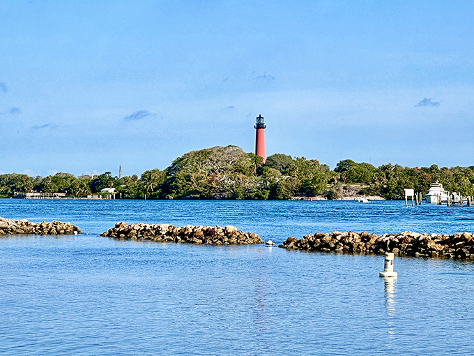 Jupiter Lighthouse stands sentinel across the water, its vibrant red tower a historic beacon guiding mariners and photographers alike.